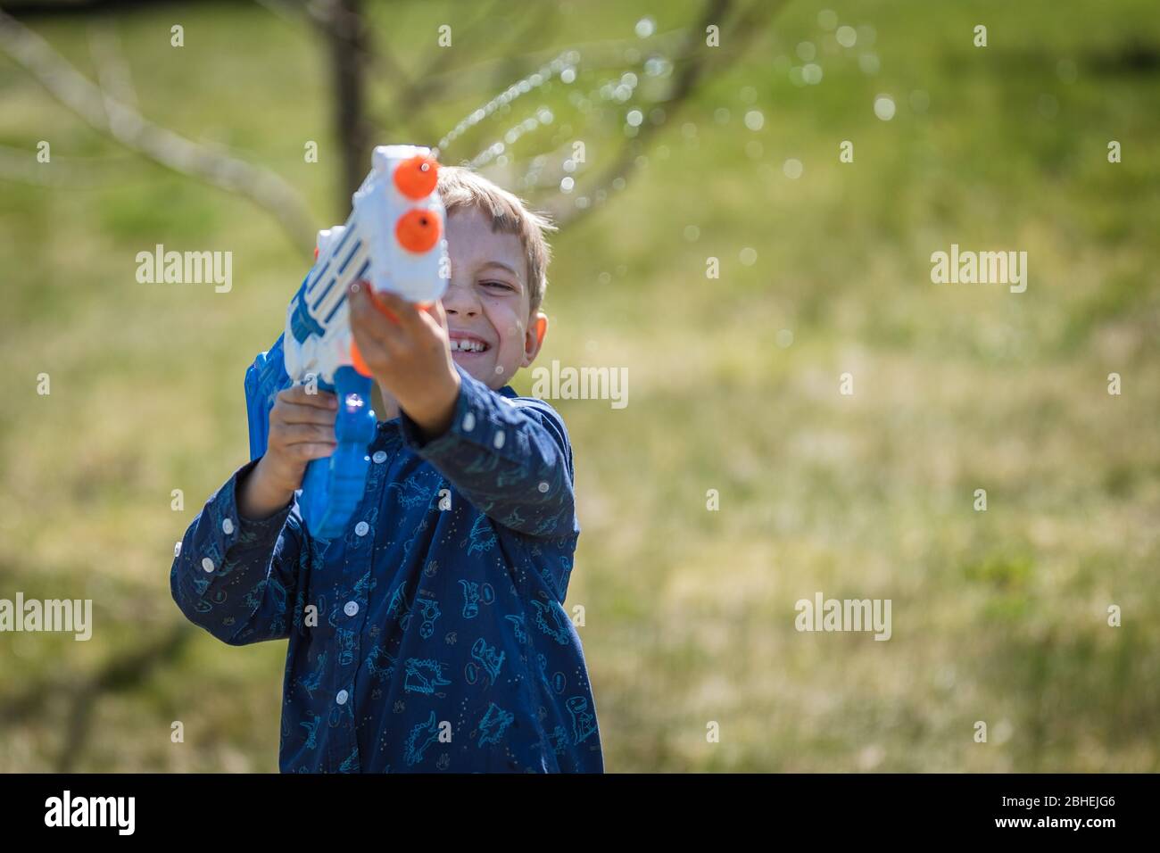 Boy water gun hi-res stock photography and images - Alamy