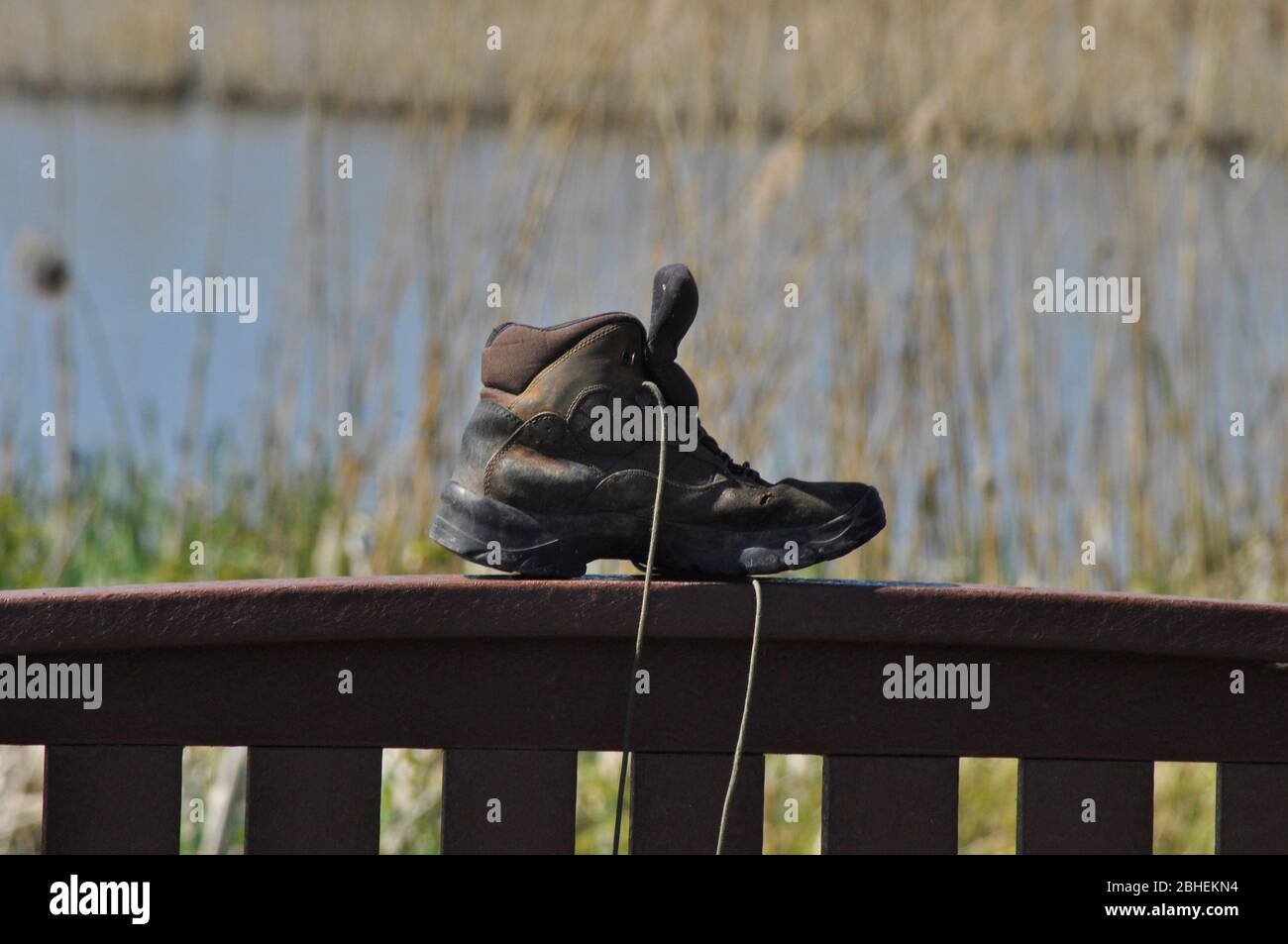 Lost Boot. Single walking boot on the back of a seat overlooking the ...