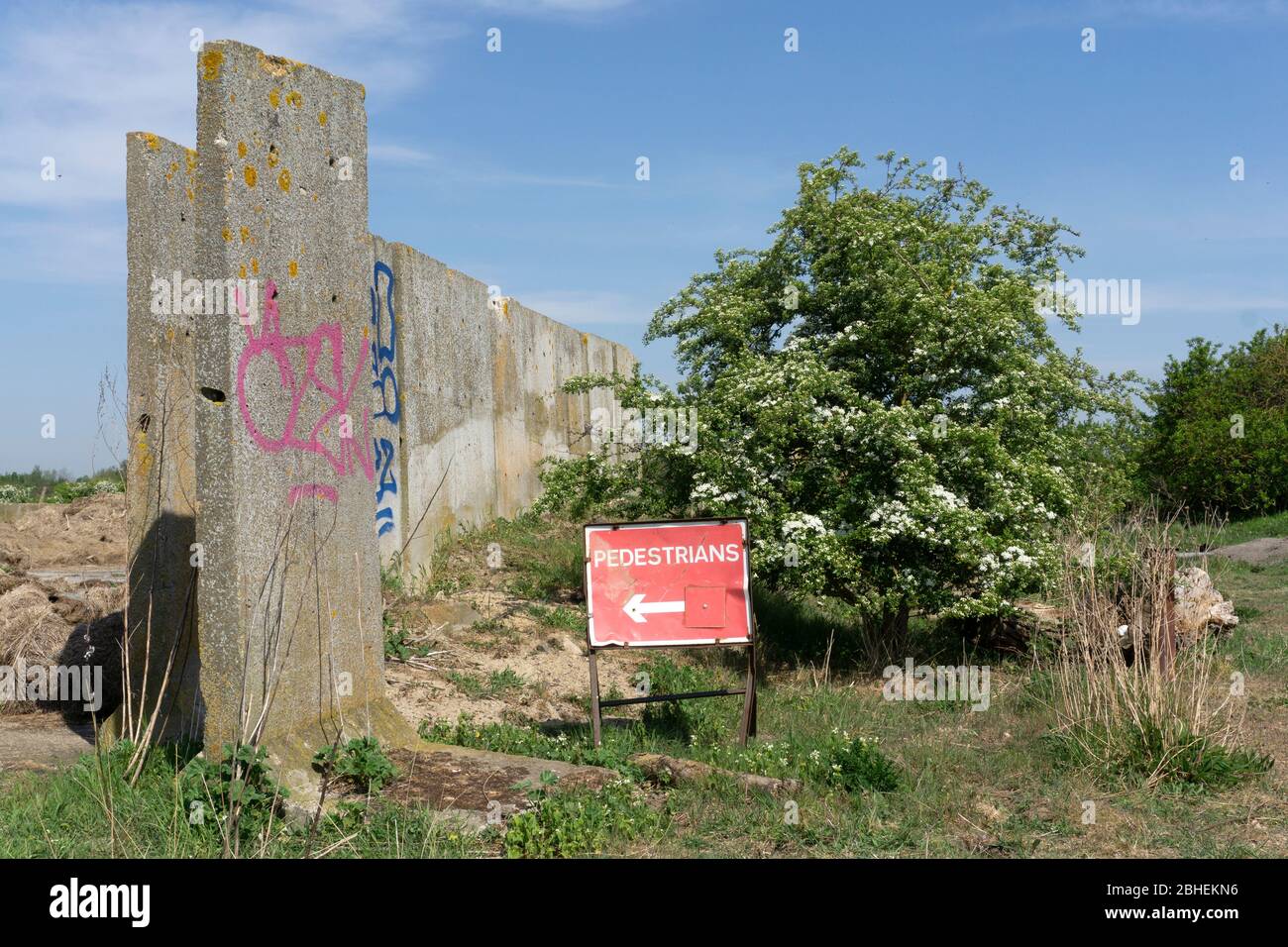Standing stones and red pedestrian sign Stock Photo - Alamy