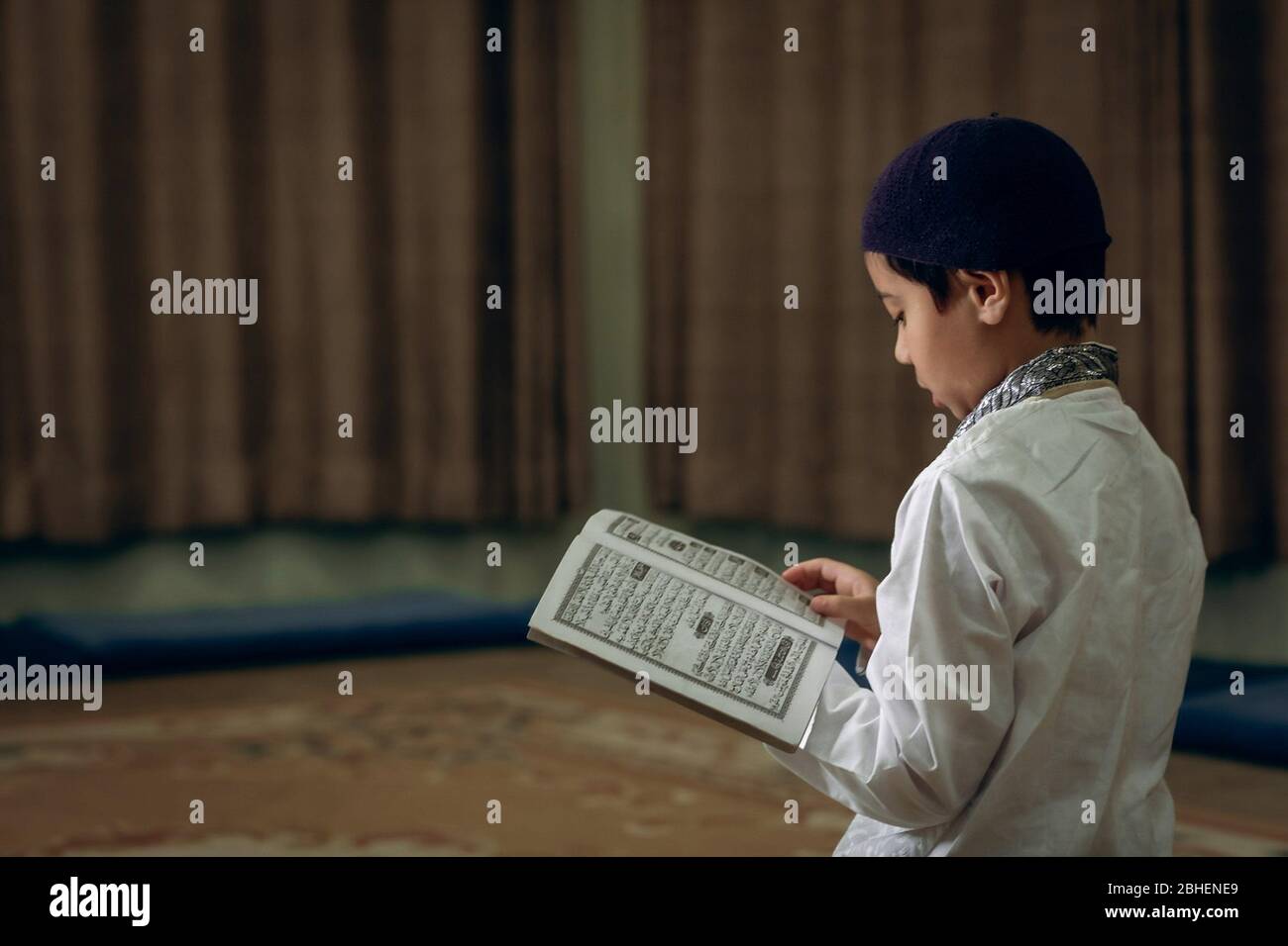 Kathmandu, Nepal. 25th Apr, 2020. A Nepalese Muslim kid reads Quran ...