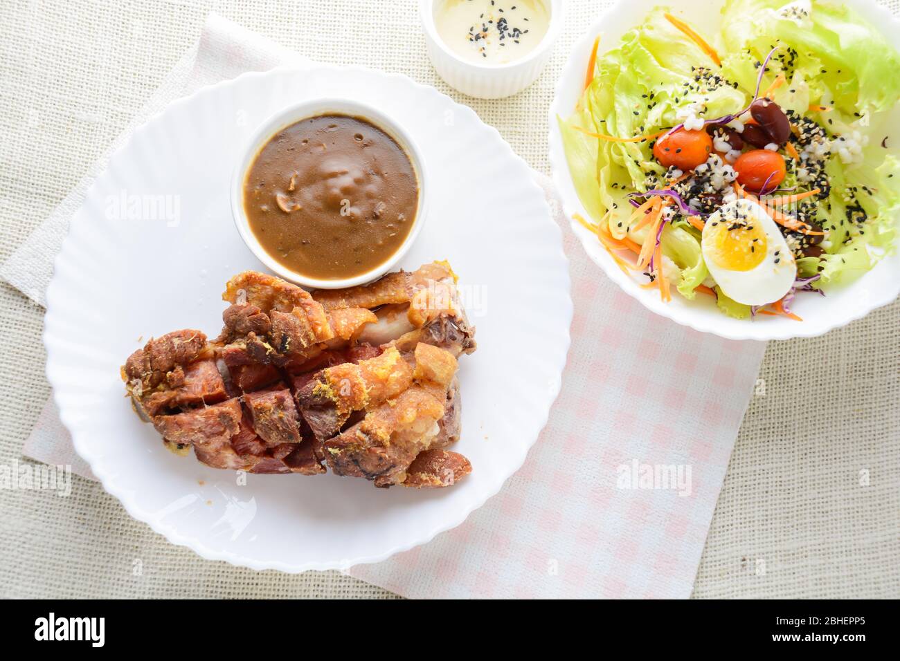 Deep fried pork knuckle with mushroom gravy source, fresh vegetable and ...