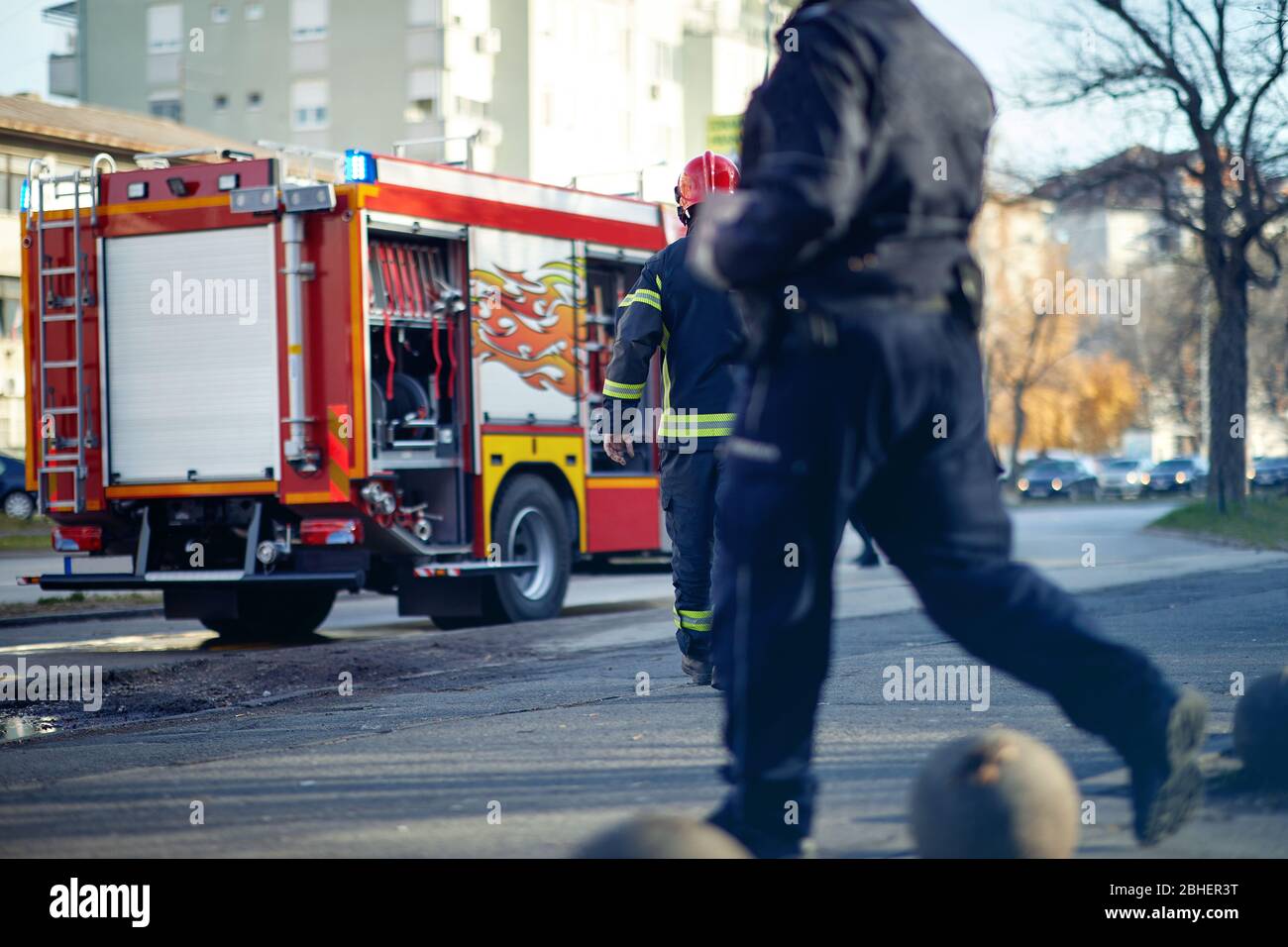 Fireman in uniform rescue and protect in protective clothing and ...