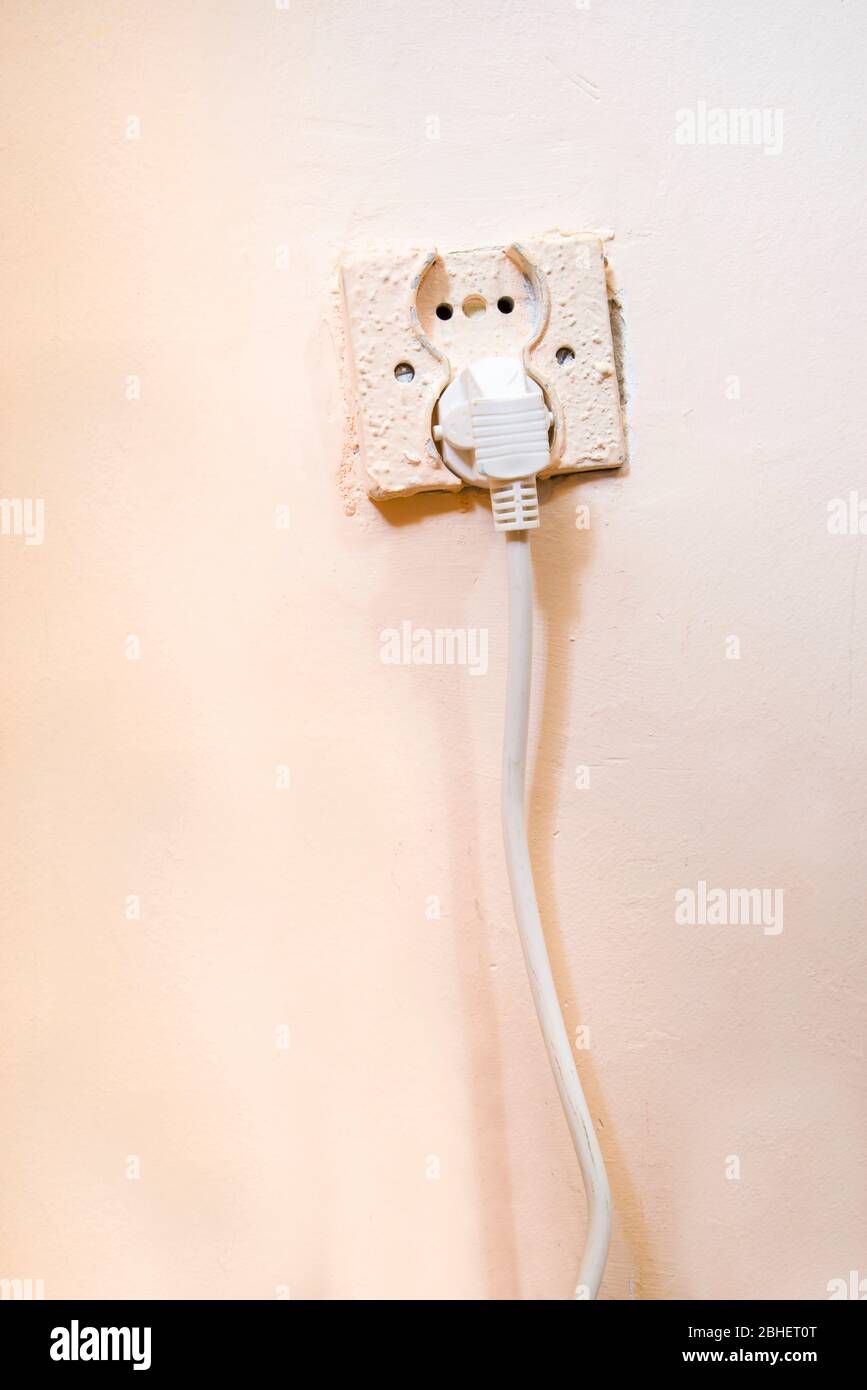 Old electrical socket with power cable pluged in Stock Photo - Alamy