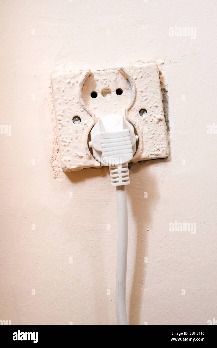 Old power socket with electric cable plug Stock Photo - Alamy