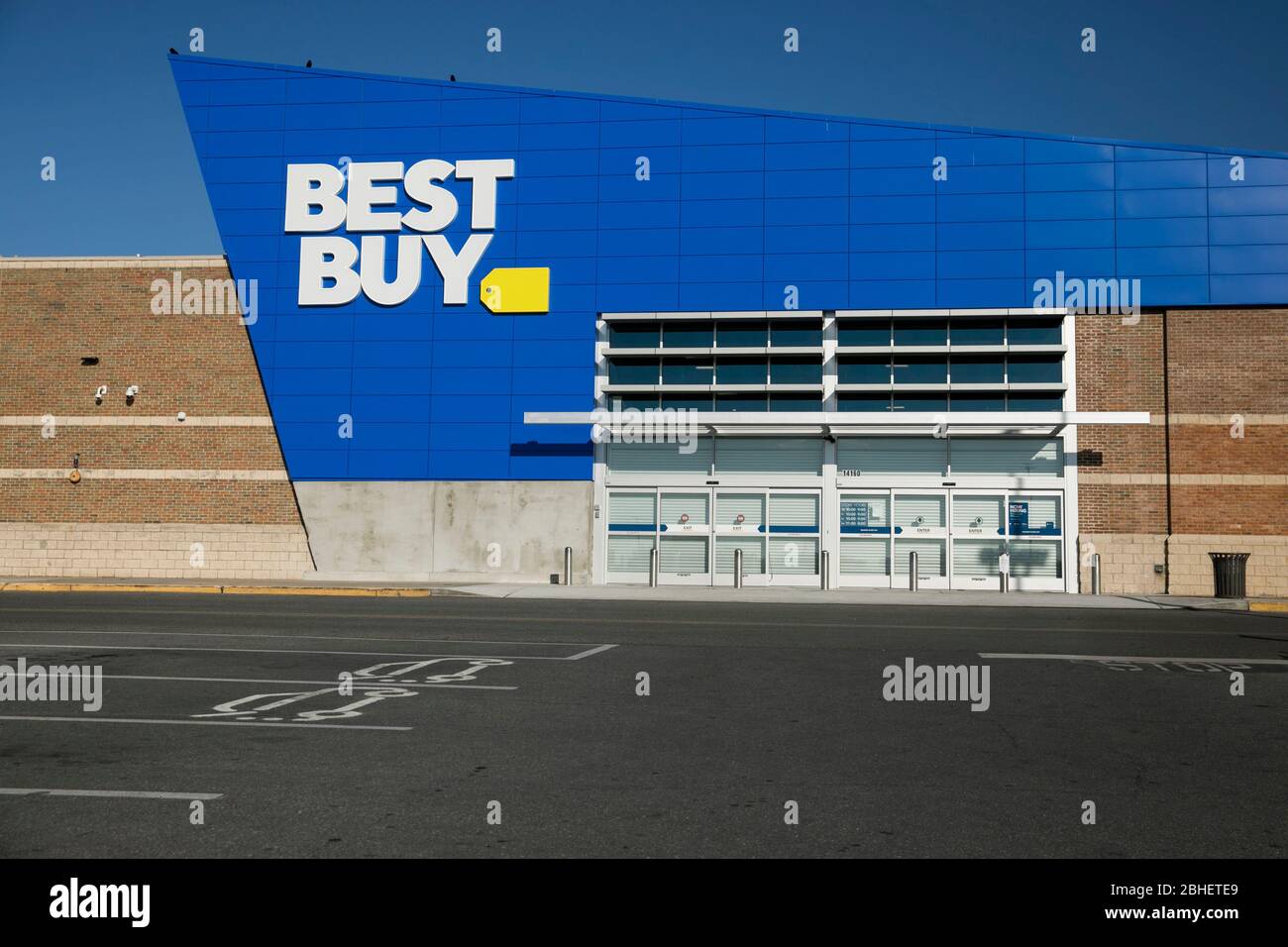 A logo sign outside of a Best Buy retail store location in Laurel ...