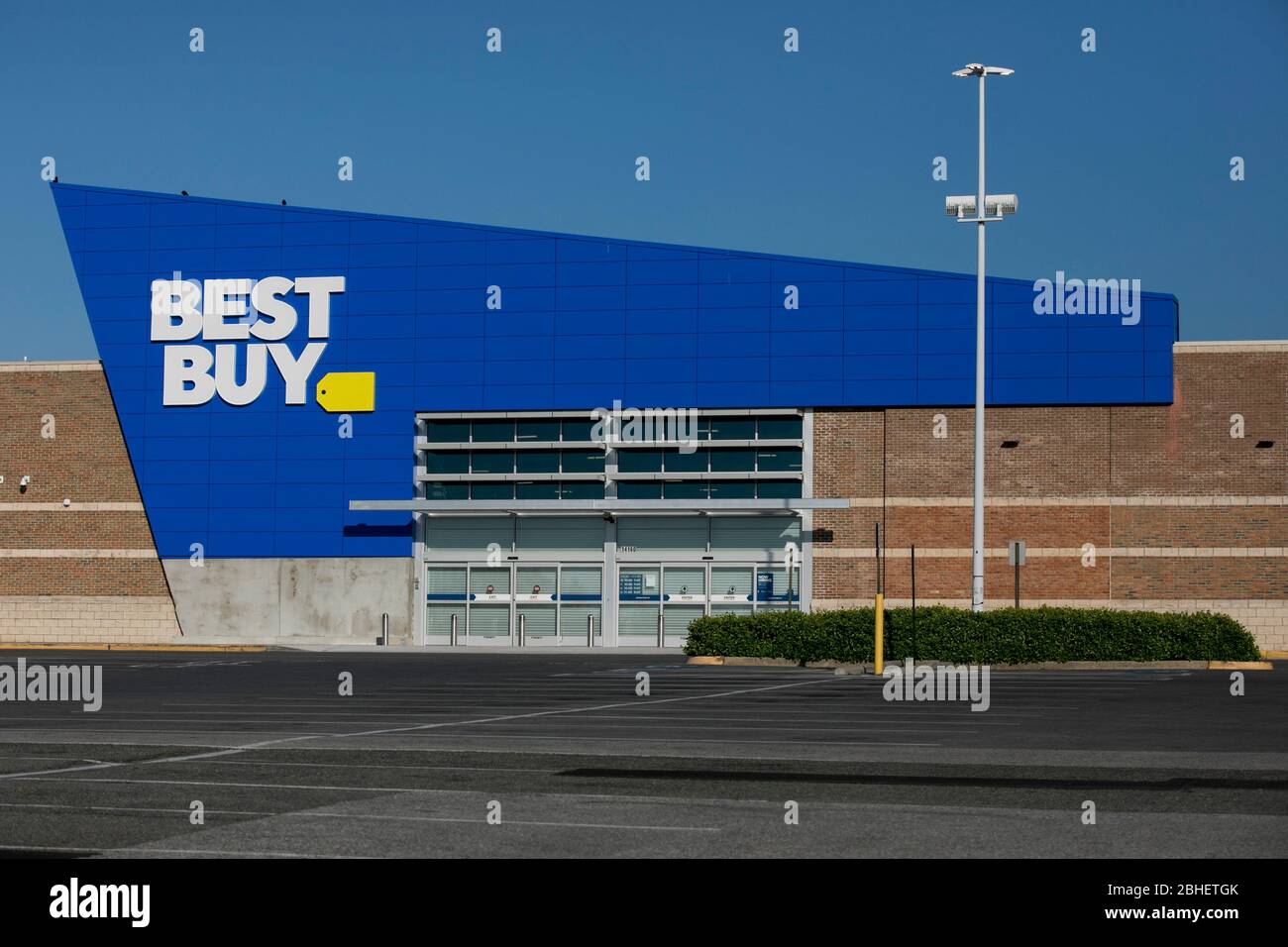 A logo sign outside of a Best Buy retail store location in Laurel ...