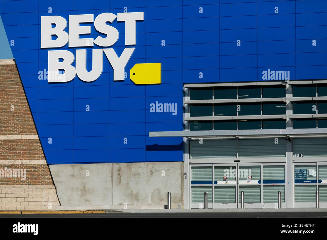 A logo sign outside of a Best Buy retail store location in Laurel ...