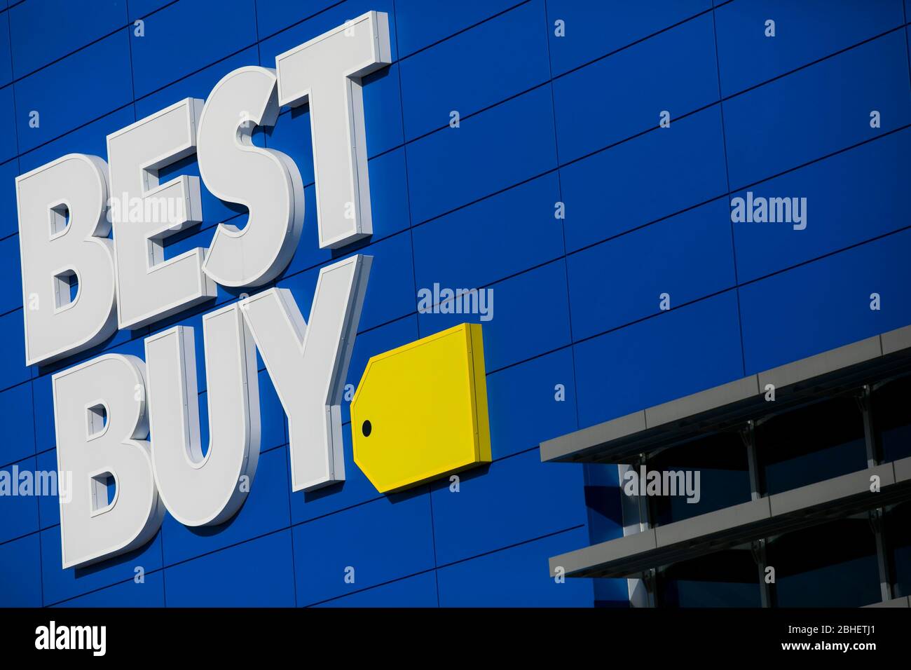 A logo sign outside of a Best Buy retail store location in Laurel ...