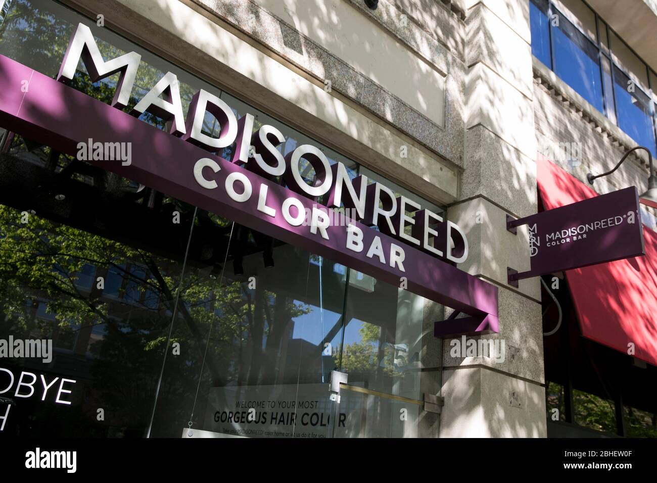 A logo sign outside of a Madison Reed Color Bar store location in ...