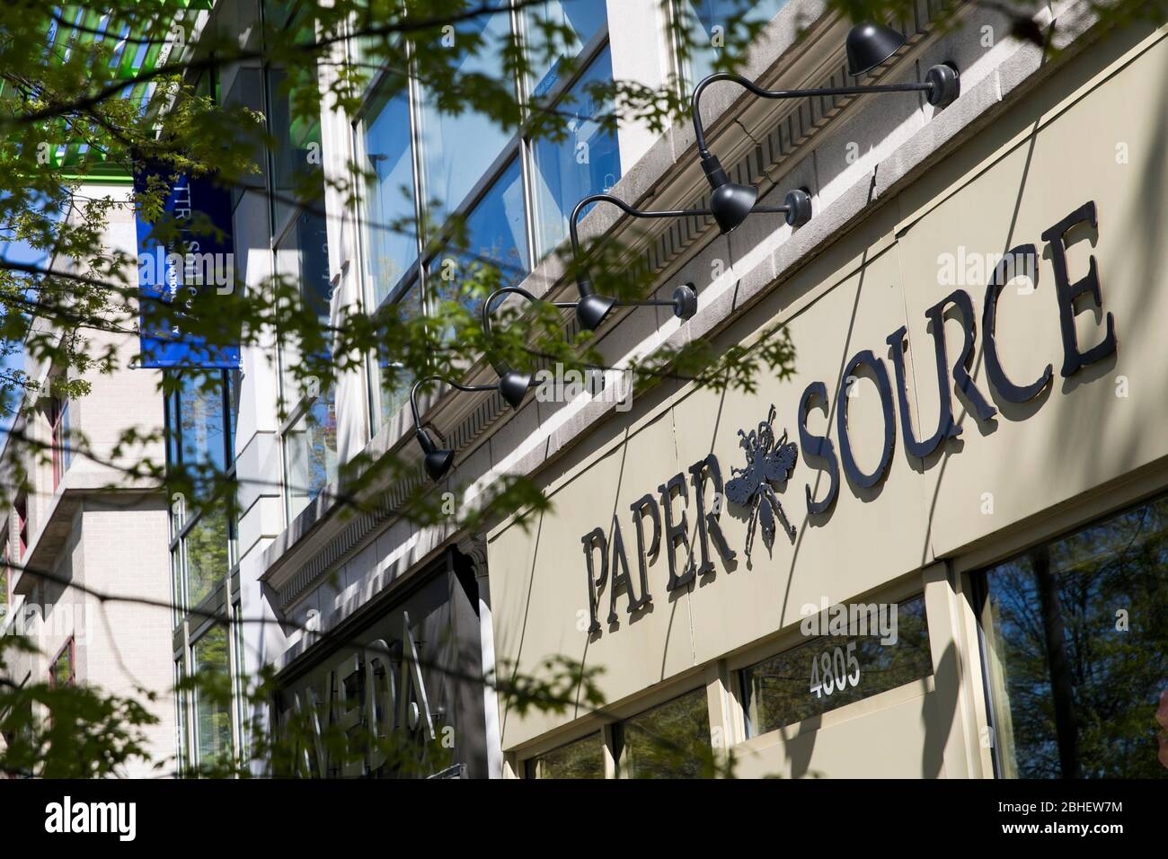 A logo sign outside of a Paper Source retail store location in Bethesda ...
