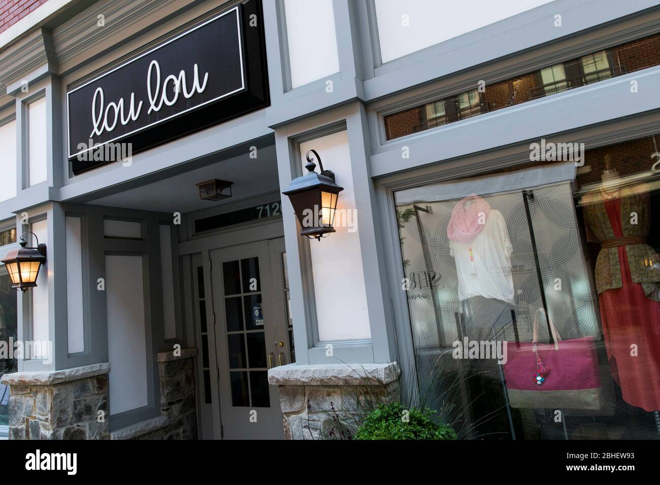 A logo sign outside of a Lou Lou retail store location in Bethesda ...