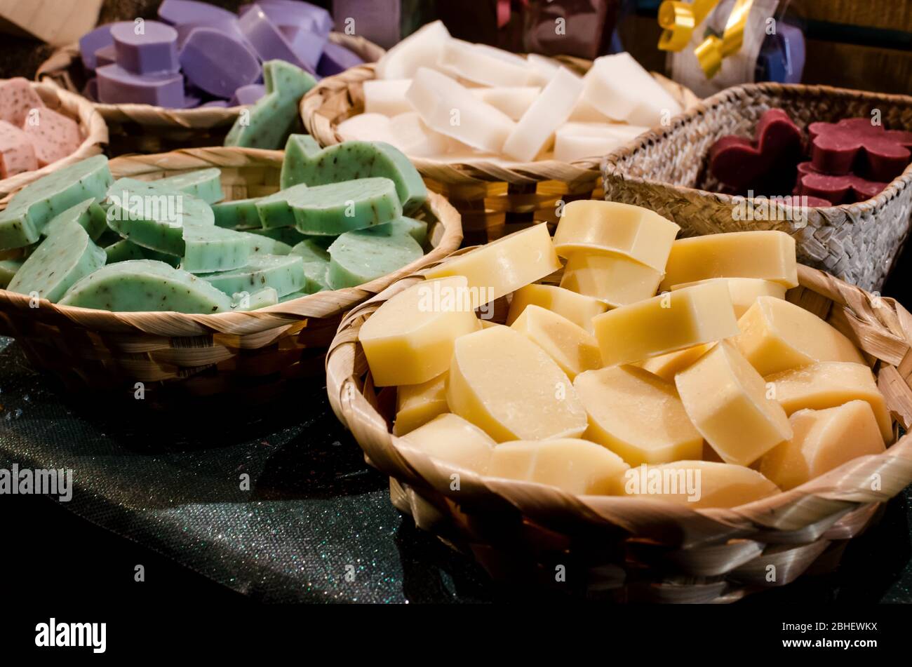 Colorful soaps on a market stall with baskets Stock Photo - Alamy