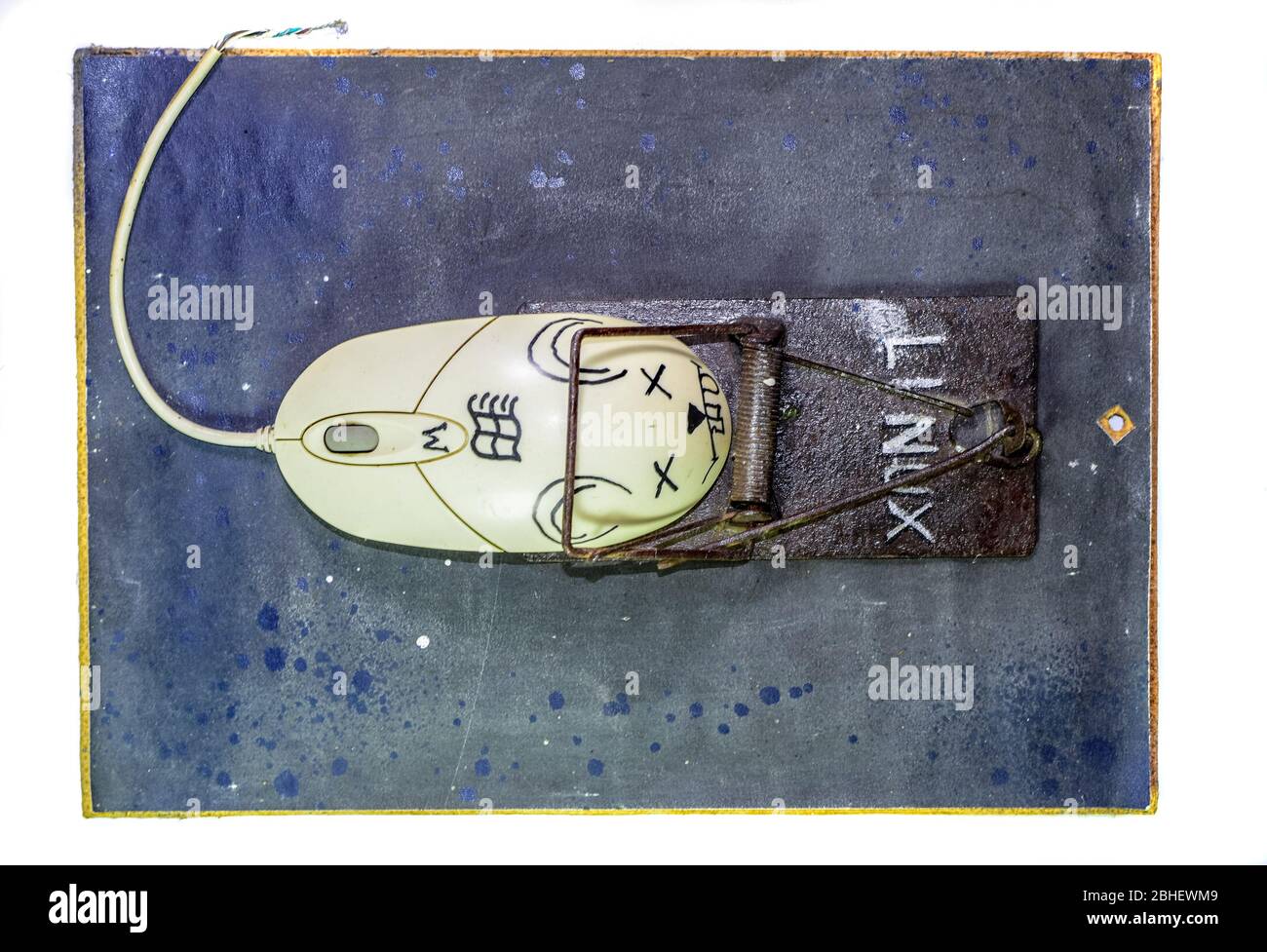 A computer mouse is a man in a mousetrap. Humorous collage in the ...