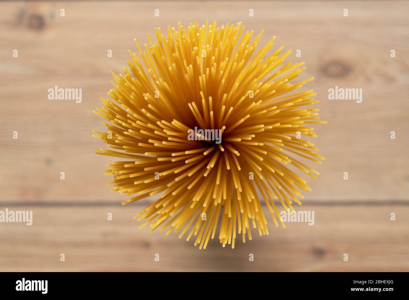 Row, uncooked spaghetti bunched together. Italian pasta or macaroni ...