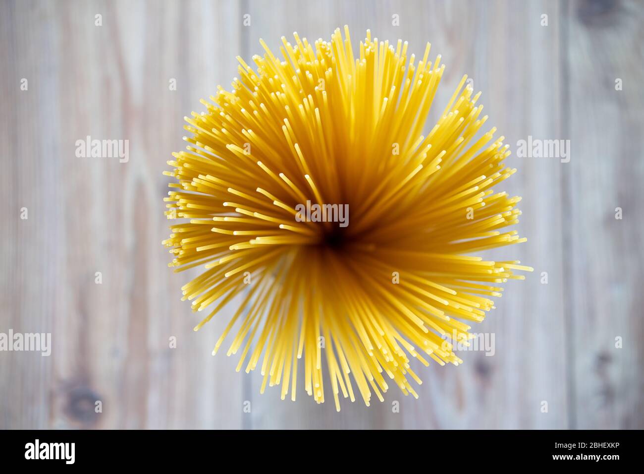 Row, uncooked spaghetti bunched together. Italian pasta or macaroni ...