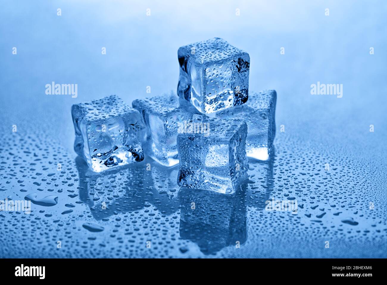 Artificial ice cubes with water drops. Tinted in blue Stock Photo - Alamy