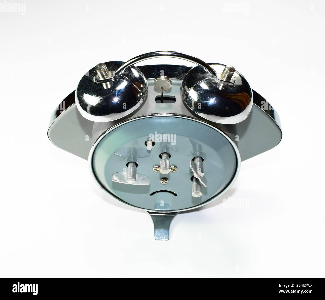 An old mechanical alarm clock. The watch is mechanical with an alarm ...