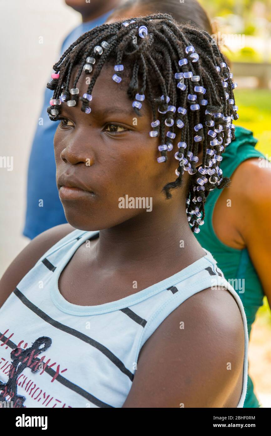 Portrait of a girl with decorations in her hair in the Garden of ...