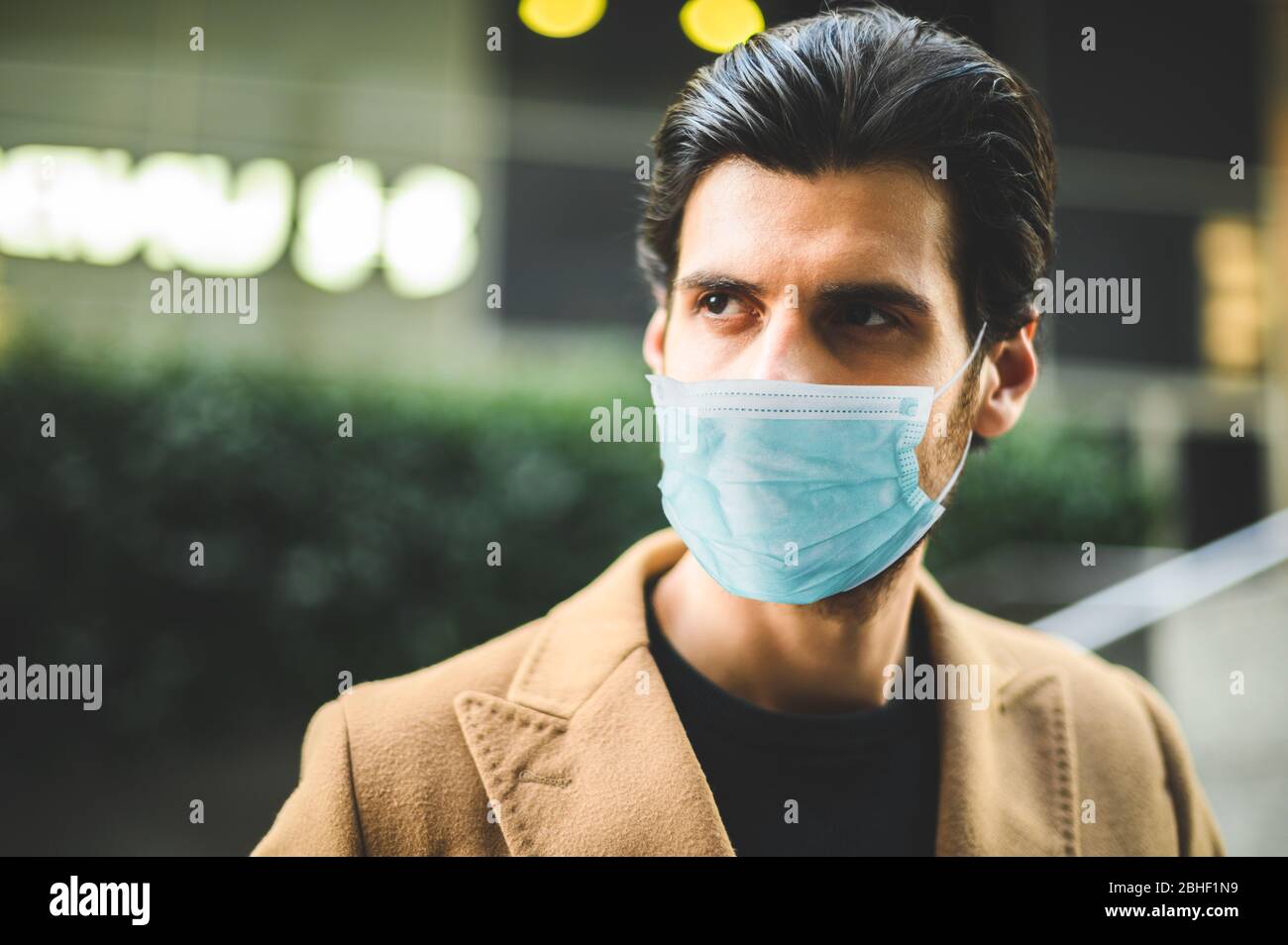 Handsome elegant man walking in the city Stock Photo - Alamy