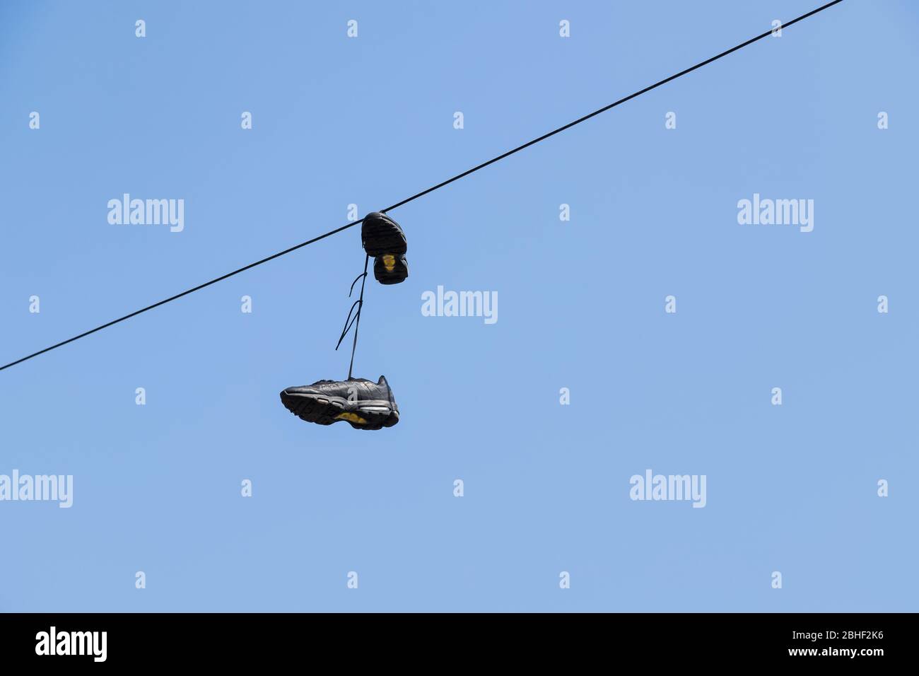 Sneakers hanging telephone wire hi-res stock photography and images - Alamy