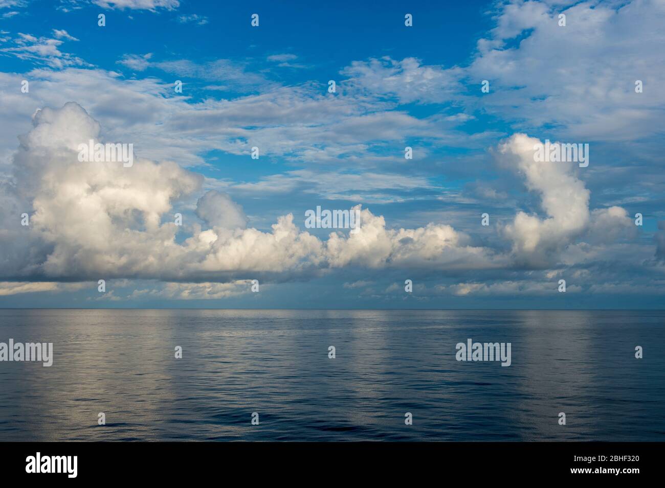 Cumulus cloud buildup over the Atlantic Ocean near Principe Island, Sao ...