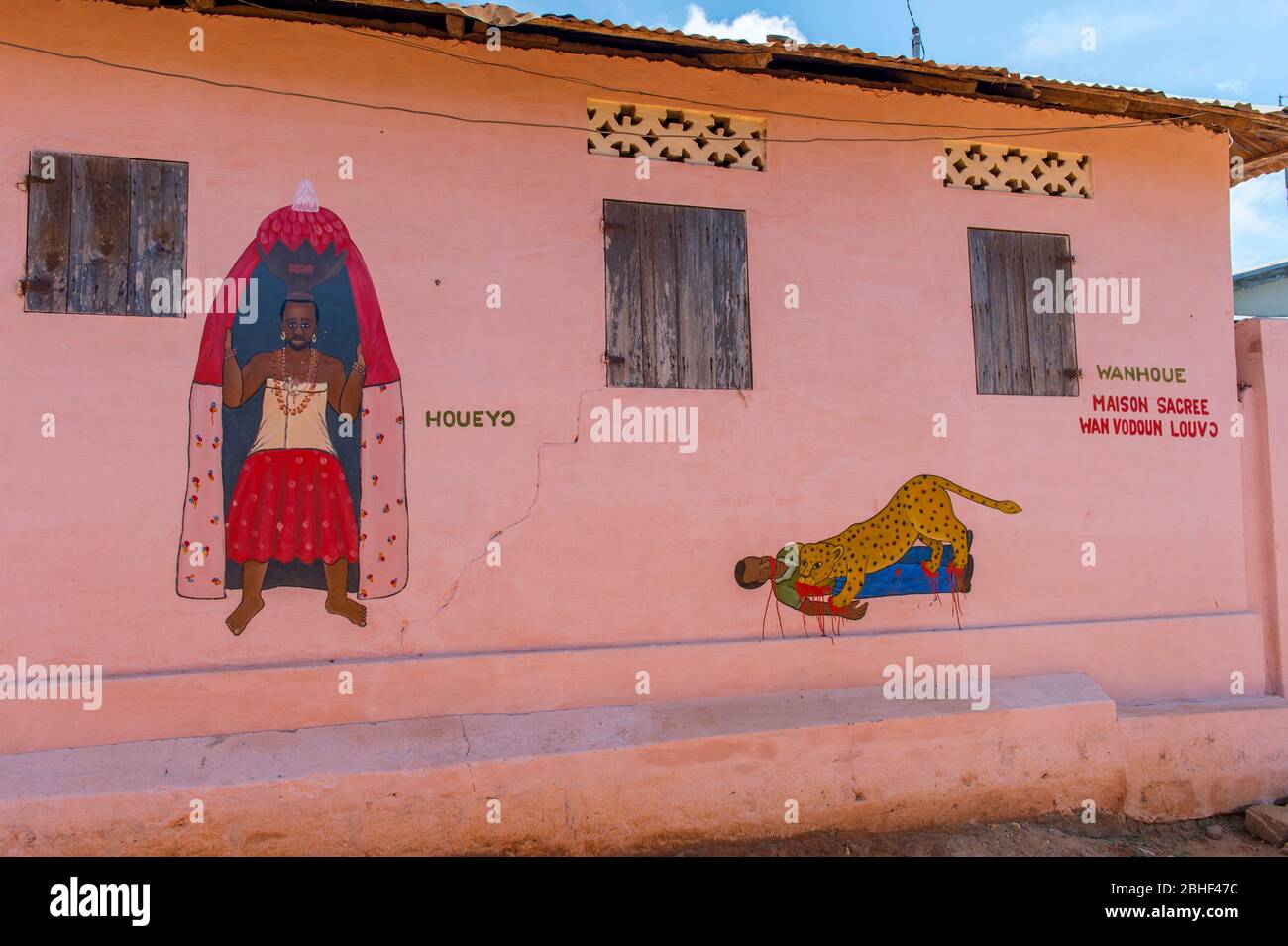 Street scene with paintings on Voodoo house in Ouidah, Benin Stock ...