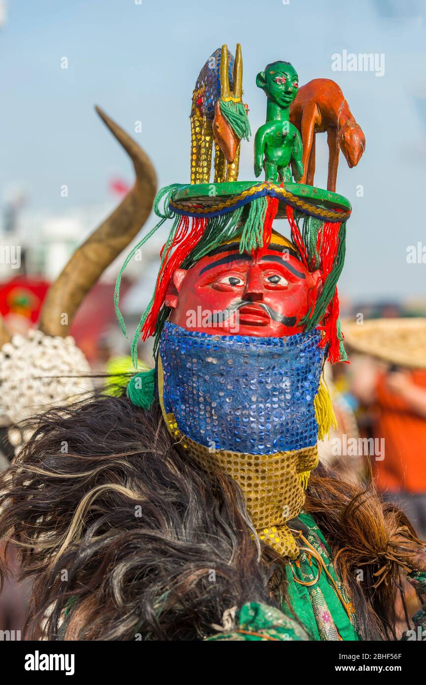 Cultural performance with mask dancers in the port of Lome, Togo Stock ...