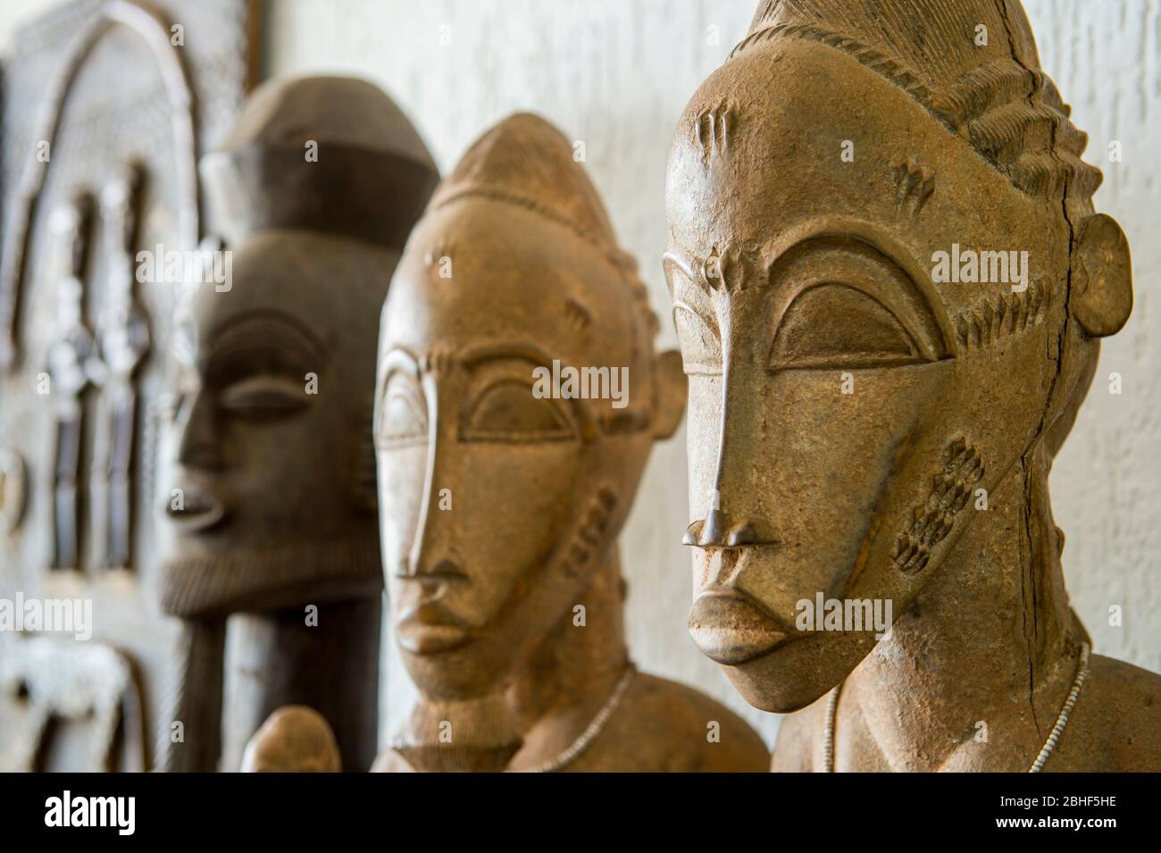 Wooden statues on display in the International Museum of Gulf of Guinea ...