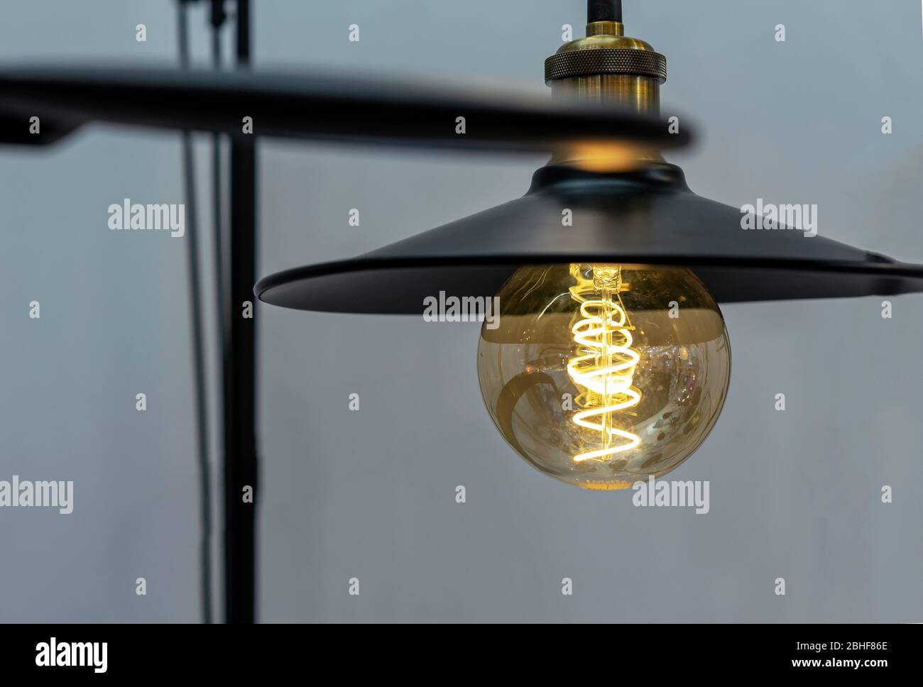 Round light bulb with dark glass in a loft style Stock Photo - Alamy