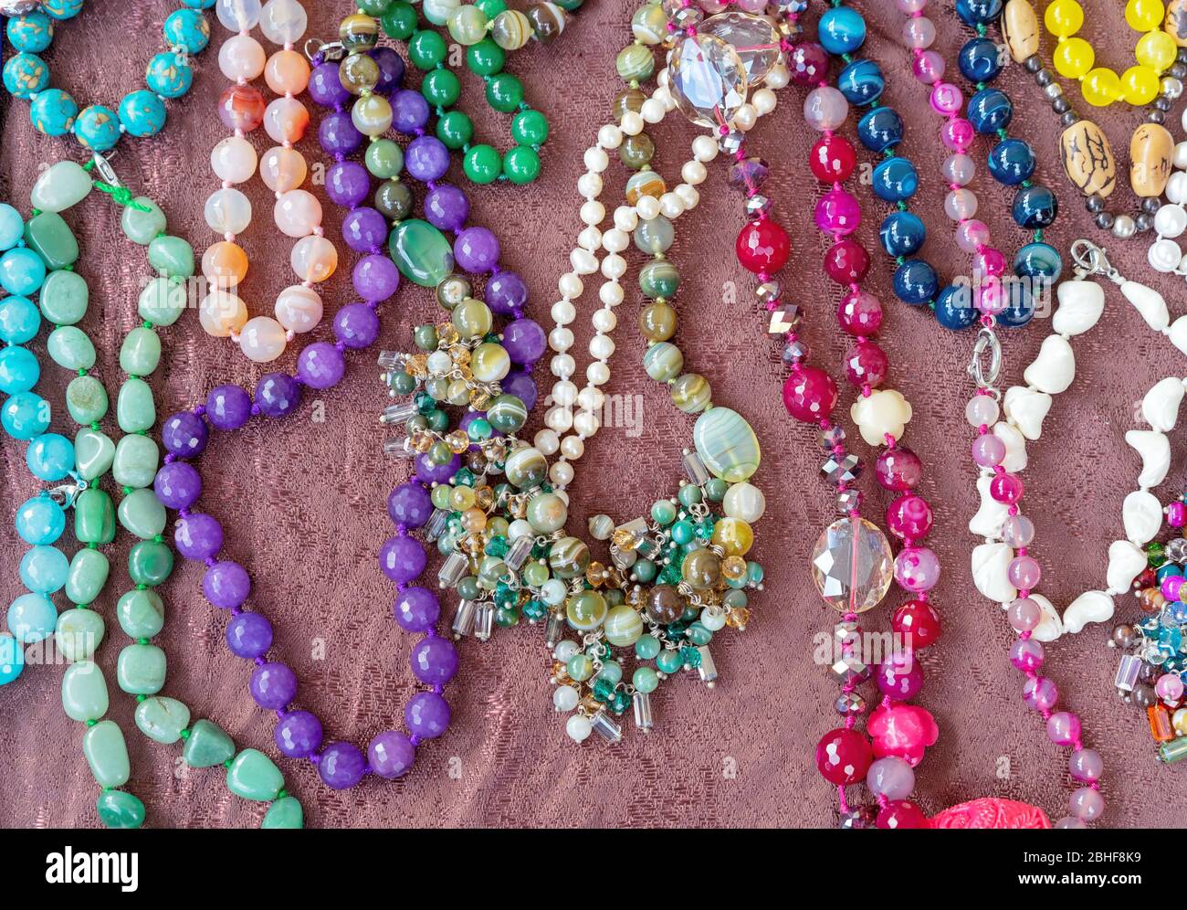 Beads from various natural semiprecious stones Stock Photo - Alamy
