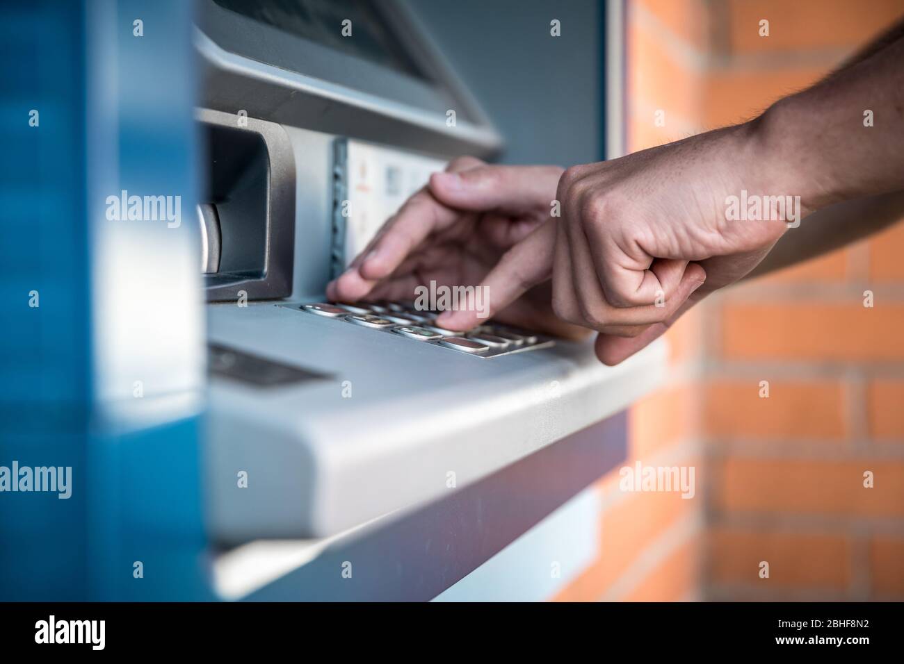 Entering a debit card pin on an ATM keyboard Stock Photo - Alamy