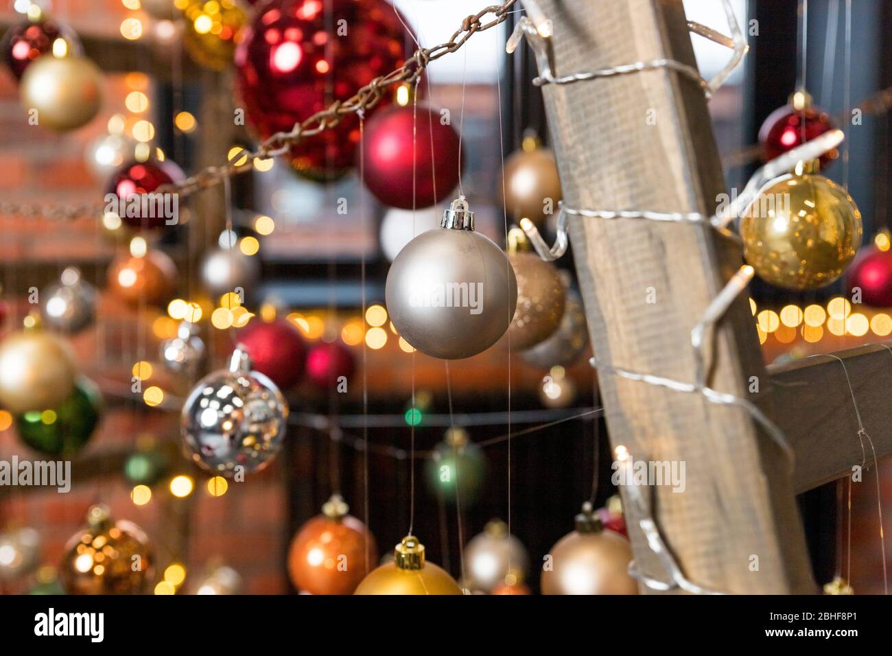 colored Christmas ball hanging on strings. festive background postcard ...
