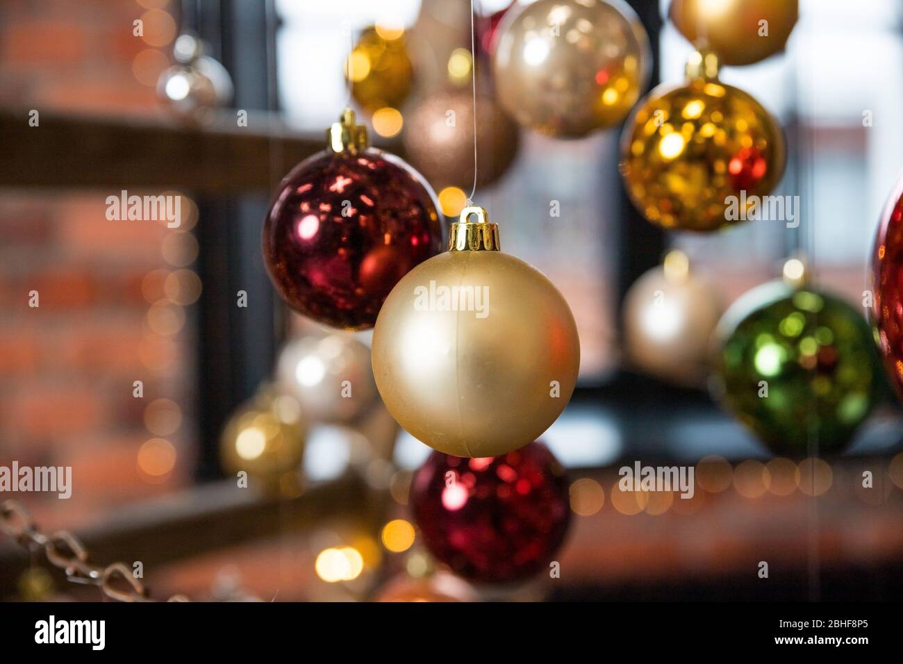 colored Christmas ball hanging on strings. festive background postcard ...