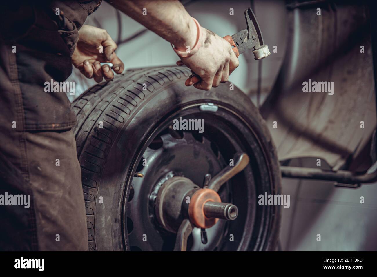 wheel balancing on special machine by adding the weights in the tire ...