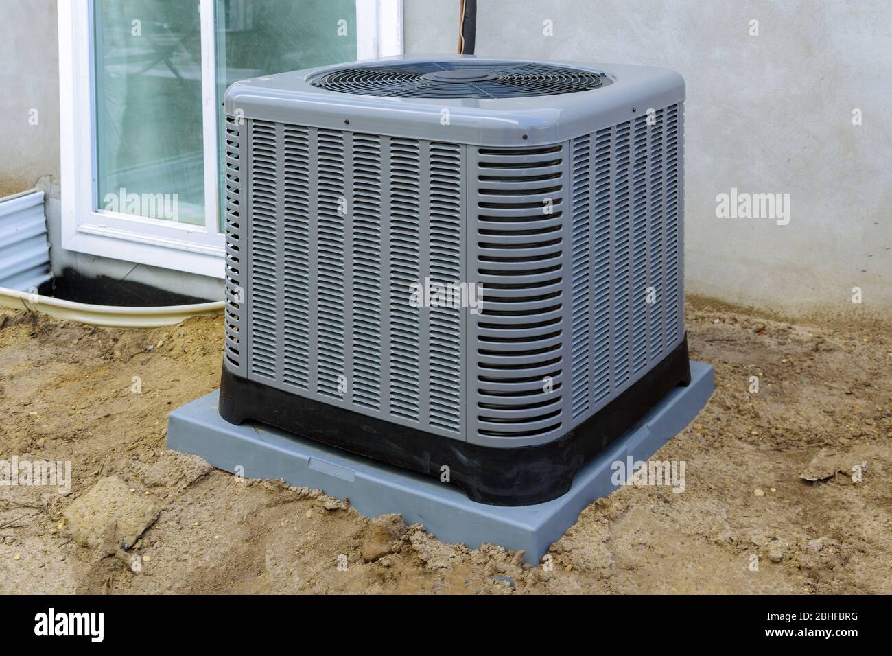 Air conditioning system unit installed outside facade of the house ...