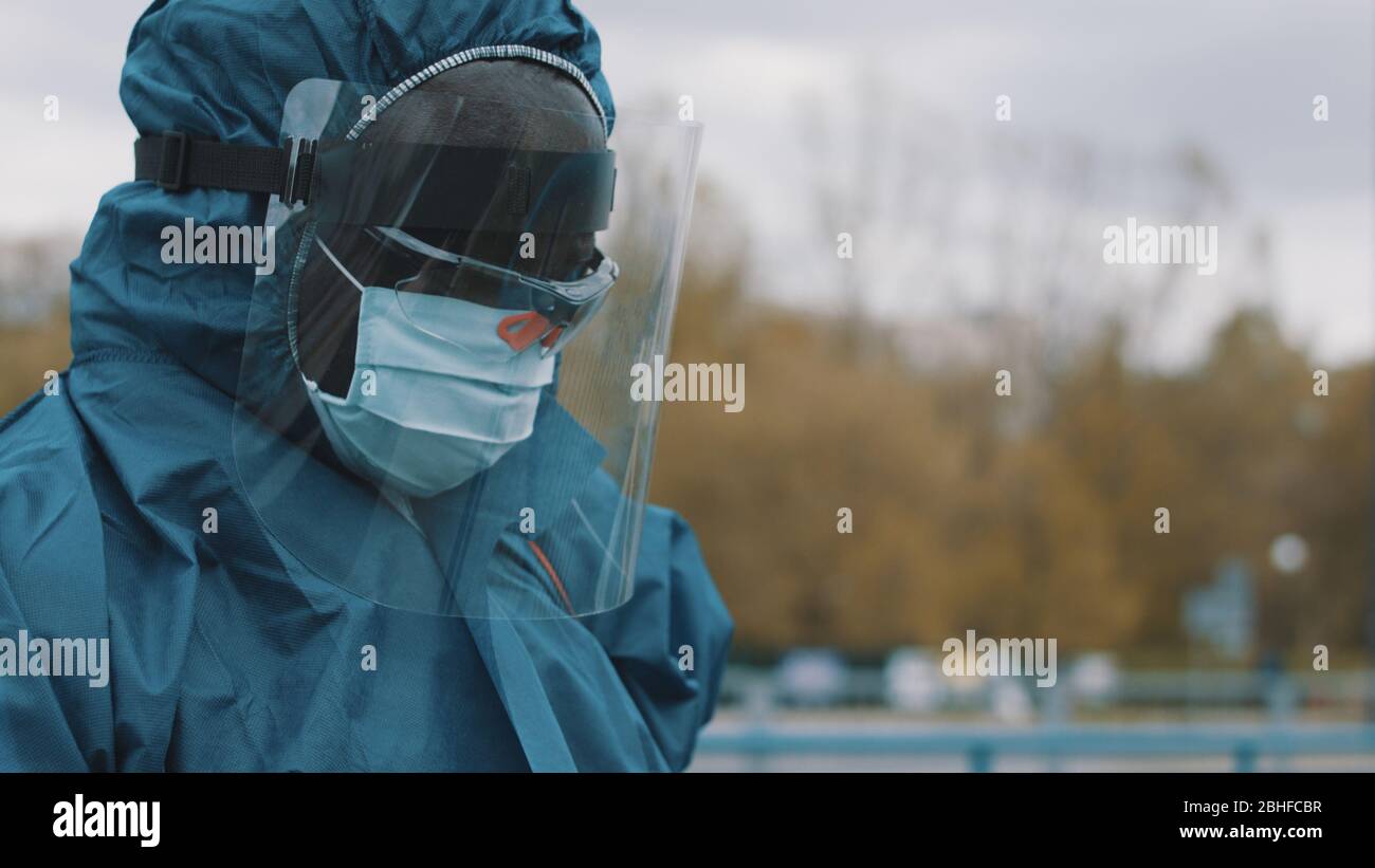 Man wearing NBC personal protective equipment ppe suit, mask, goggles ...