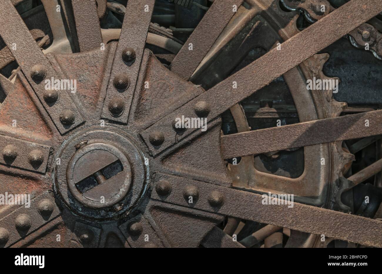 Flywheel of a historic tractor Stock Photo - Alamy