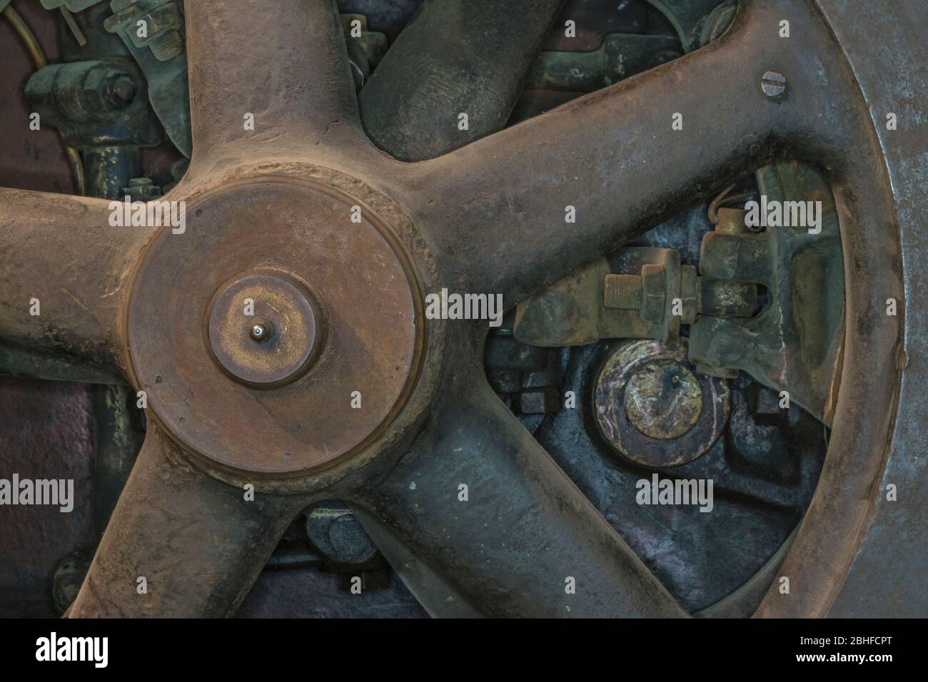 Flywheel of a historic tractor Stock Photo - Alamy