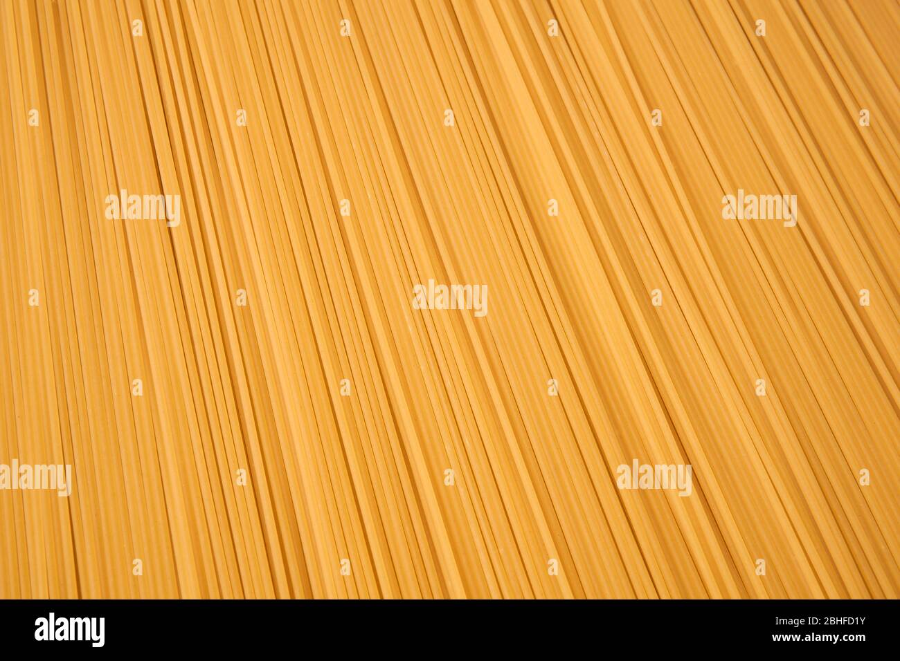 background of dry uncooked spaghetti pasta close-up Stock Photo - Alamy