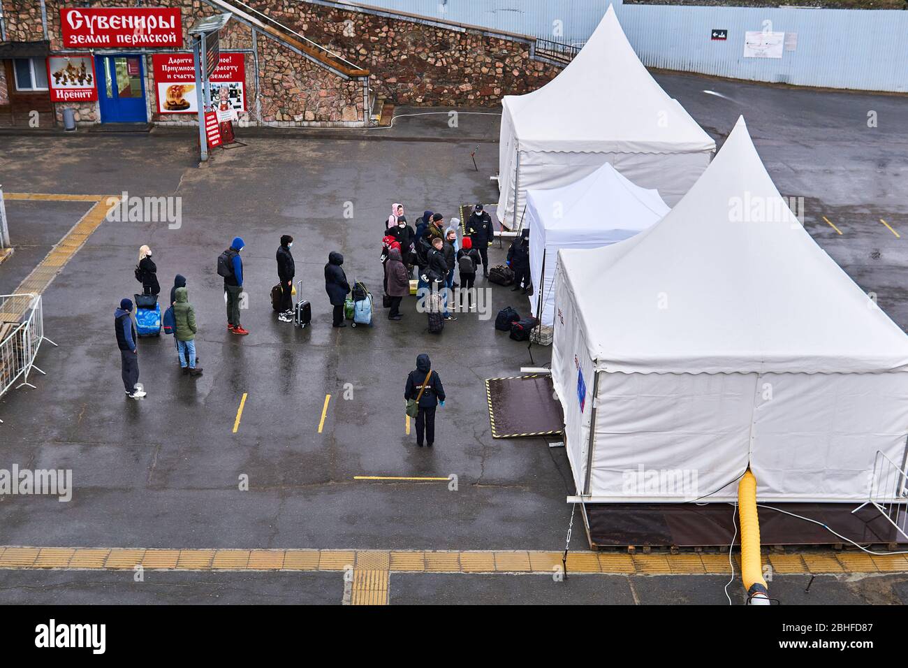 Perm, Russia - April 25, 2020: passengers pass through temperature ...