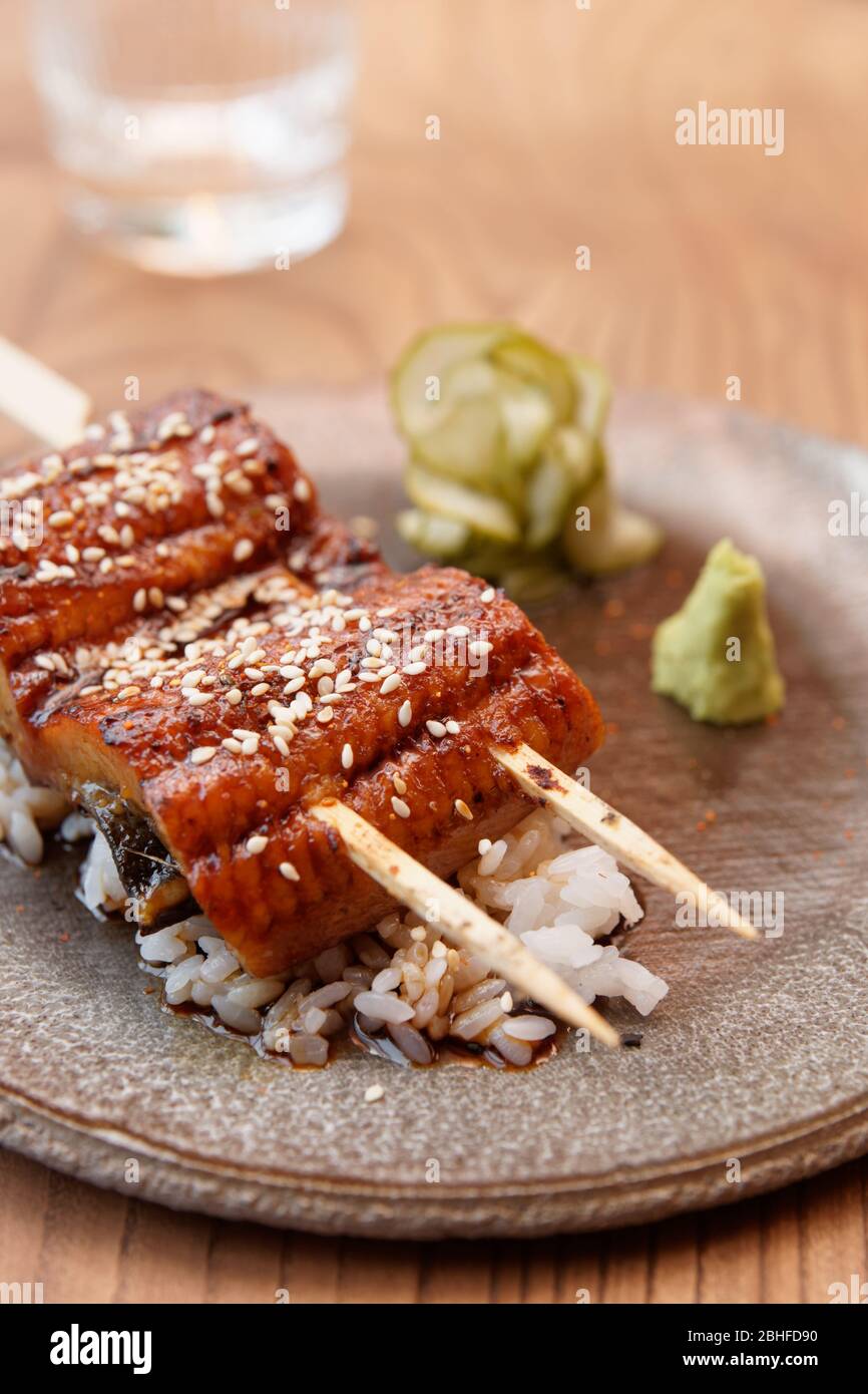 Fried unagi eel with barbecue sauce and rice in clay pale Stock Photo ...