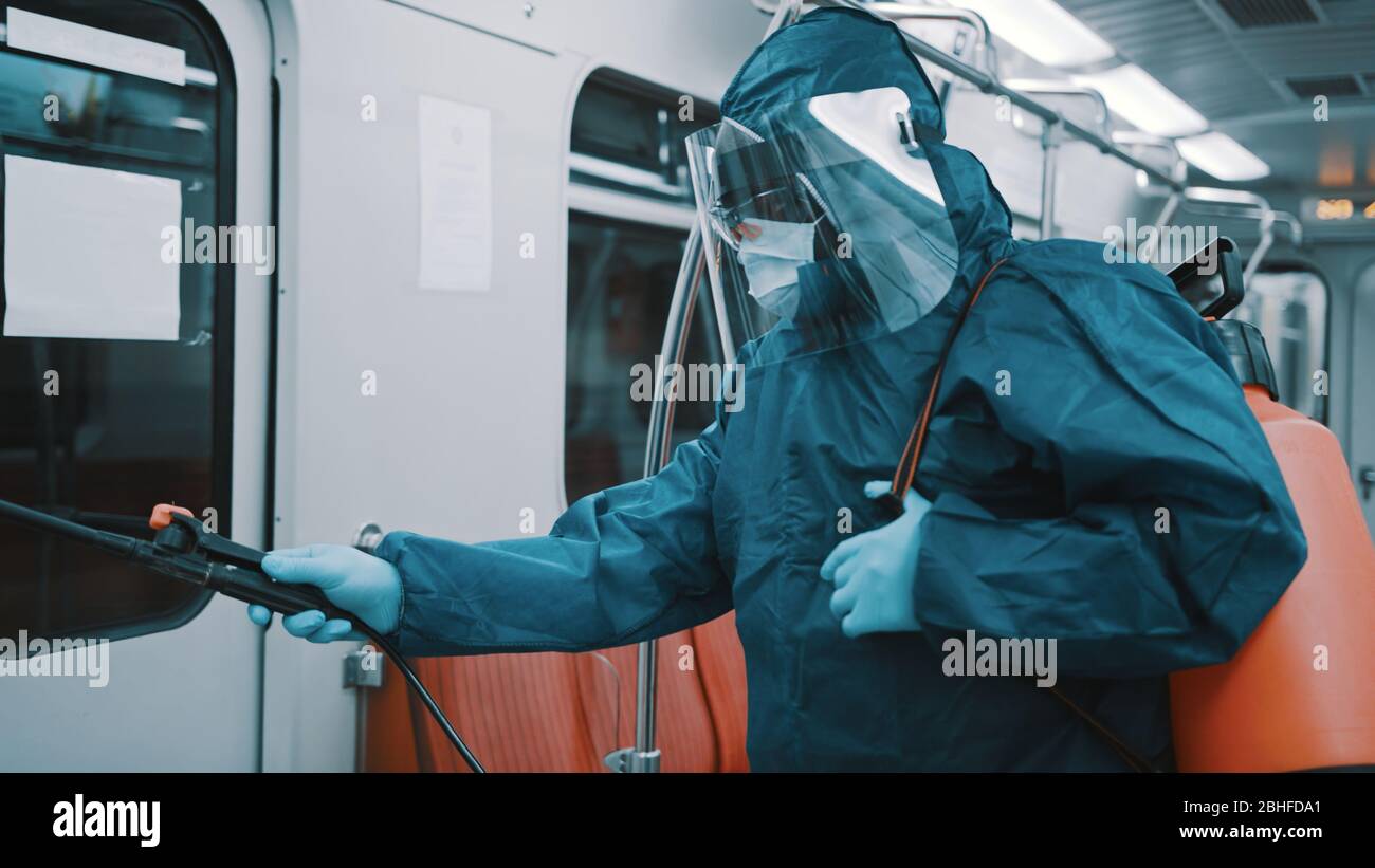African man with protective suit , face shield, mask and gloves ...