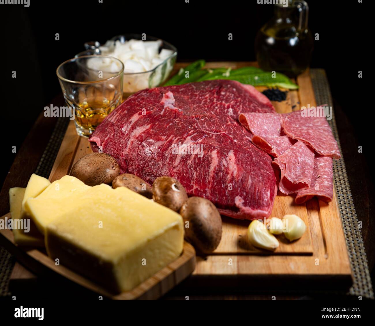 piece of raw picanha with cheese and vegetables to prepare Stock Photo ...