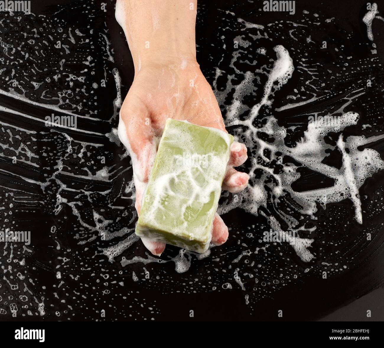 process of washing hands with soap, parts of the body in white foam on ...