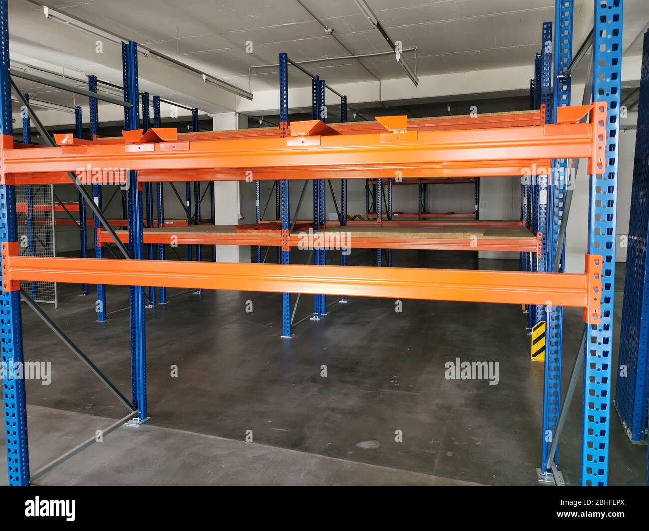 empty heavy duty racks in a company as production is at a standstill ...