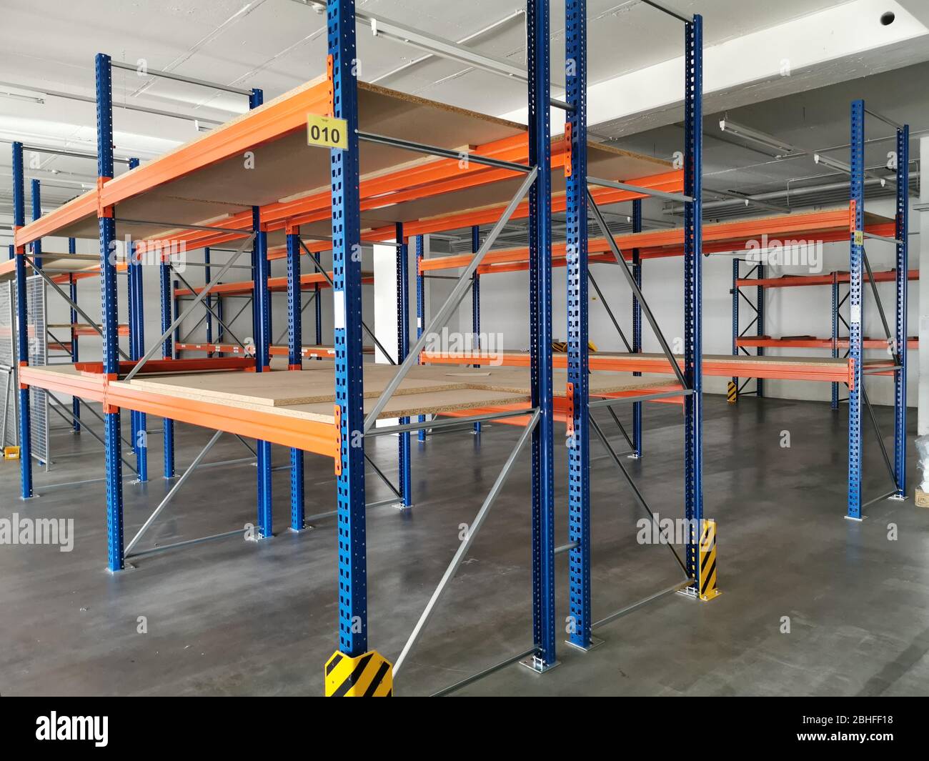 empty heavy duty racks in a company as production is at a standstill ...