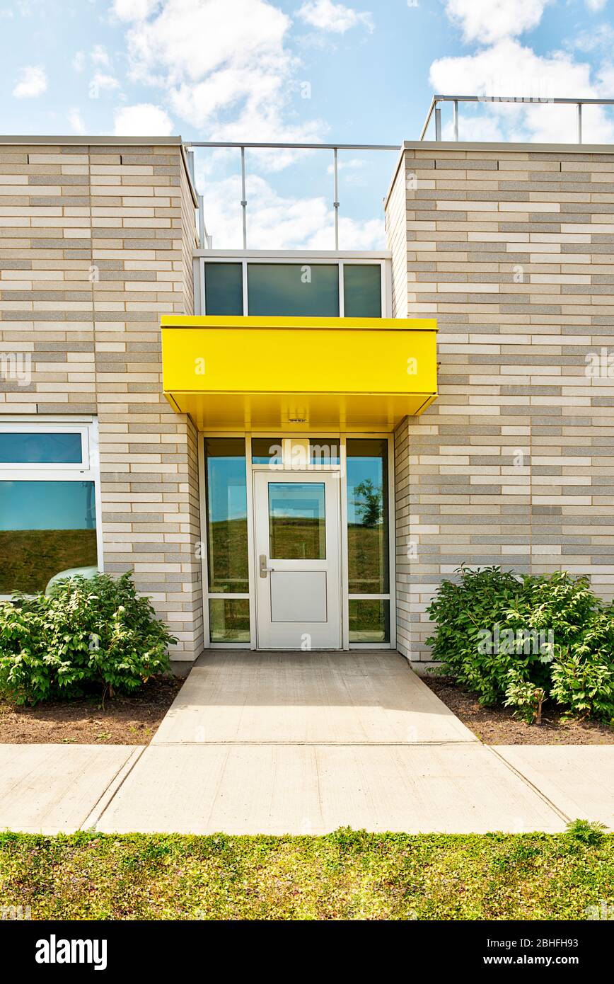 Modern primary school building architecture, door entrance. Sunny ...
