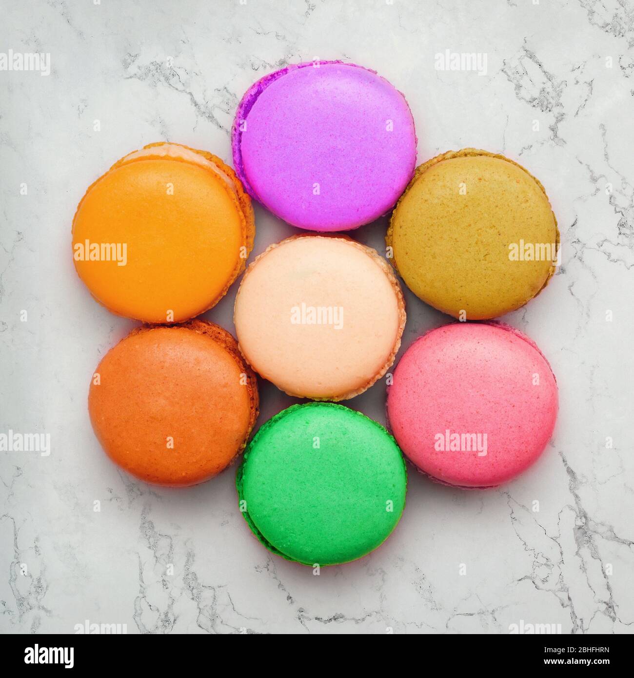 Flat lay of colorful macaroons on marble background Stock Photo - Alamy
