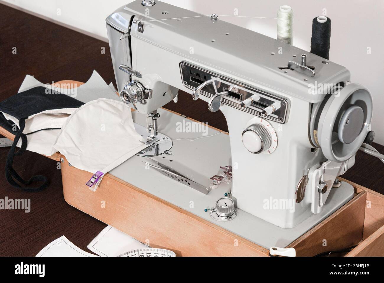 Sewing reusable handmade cloth face masks. Making home made breathing ...