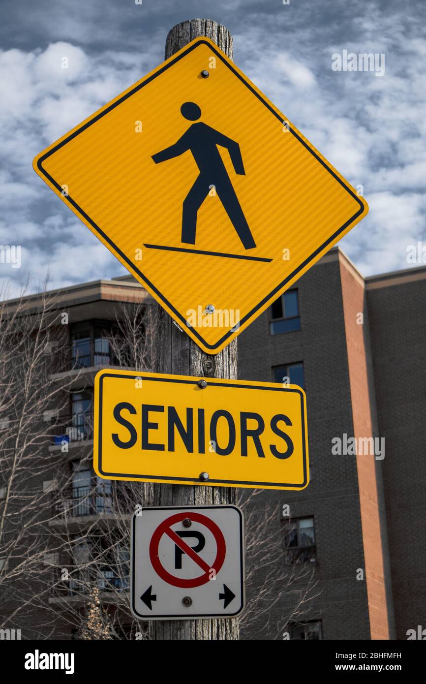 A sign that reminds us that seniors sometimes cross the street and so ...